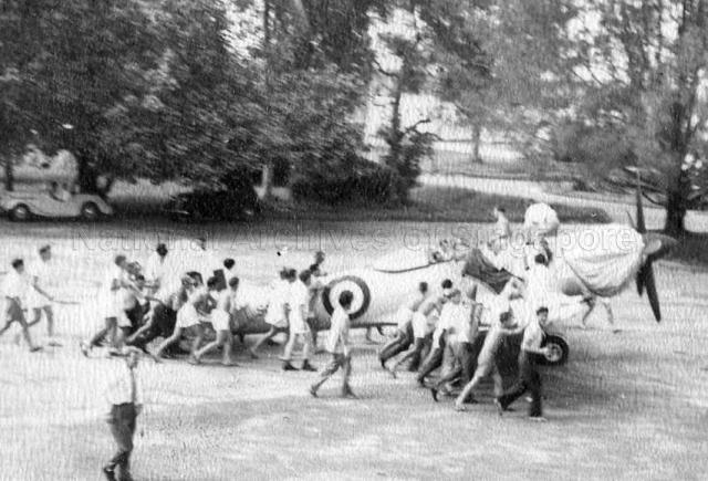 Photograph of a group of airmen pushing the Supermarine