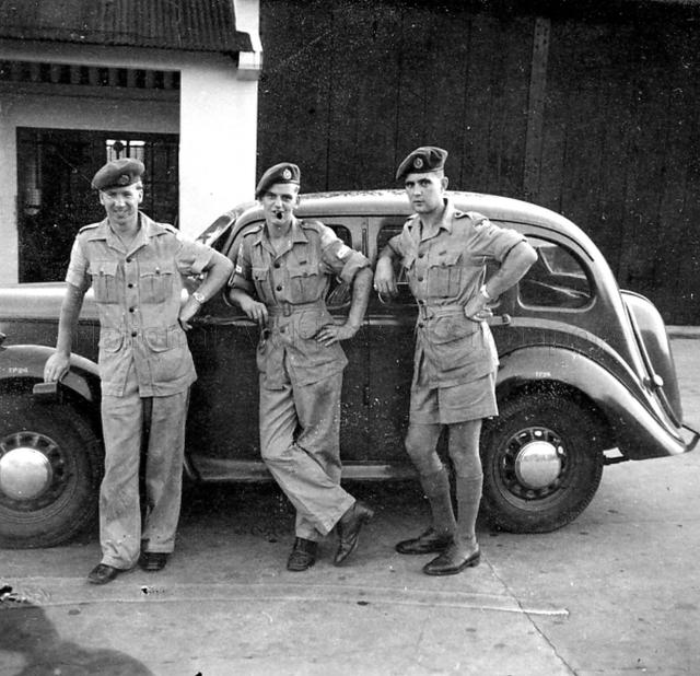 Photograph of three airmen from the Motor Transport (MT) A