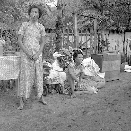 FIRE AT KAMPONG SIGLAP - TEARFUL VICTIMS WITH THEIR