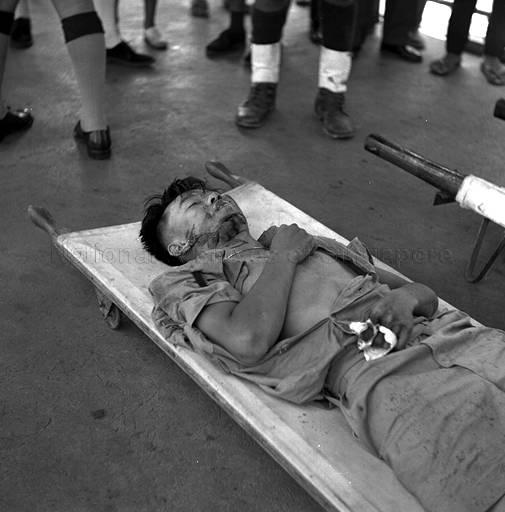 PULAU SENANG RIOT - ONE OF THE VICTIMS LAYING ON A