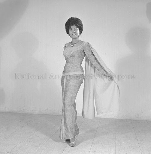 A MODEL IN A SARONG AND KEBAYA DESIGNED BY VICKI DUTTON.