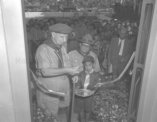 SCOUT COMMISSIONER FRANK C SANDS CUTS THE RIBBON TO OPEN