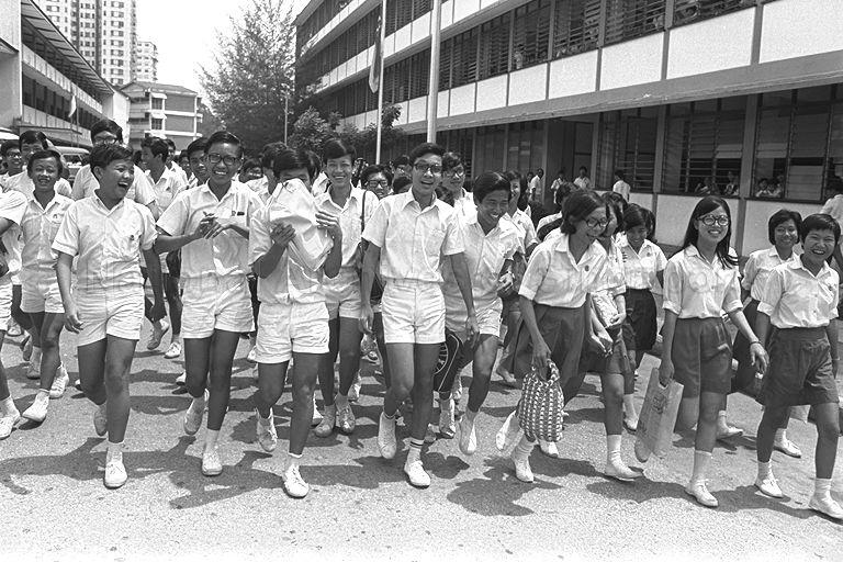 STUDENTS LEAVING SCHOOL AT KIM SENG TECHNICAL SCHOOL. THEY