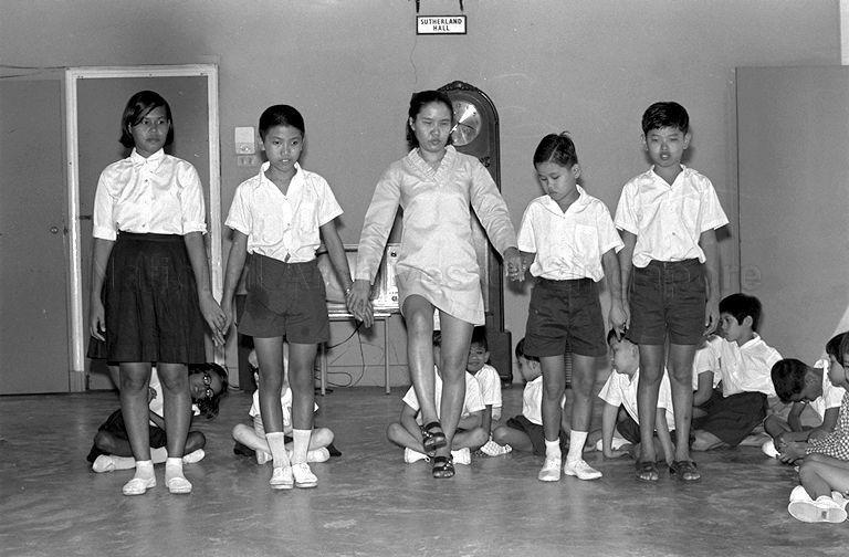 MISS CHAN POH LIN (THIRD LEFT) IS AN ASSISTANT TEACHER FOR