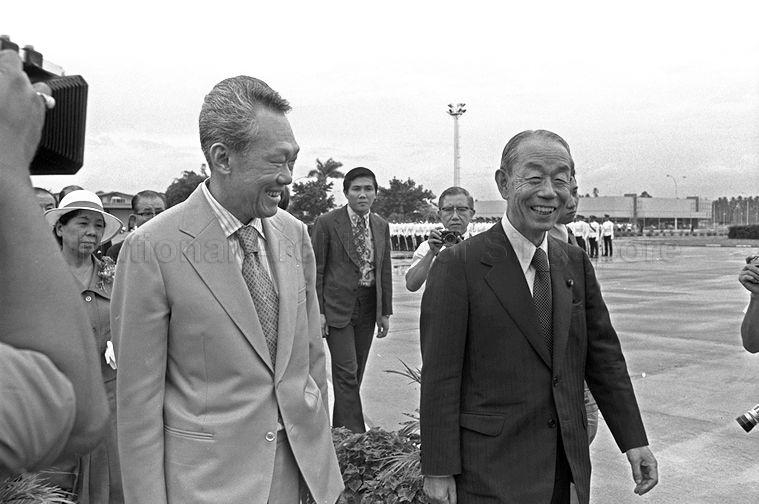 THE JAPANESE PRIME MINISTER (PM) TAKEO FUKUDA (RIGHT) AND